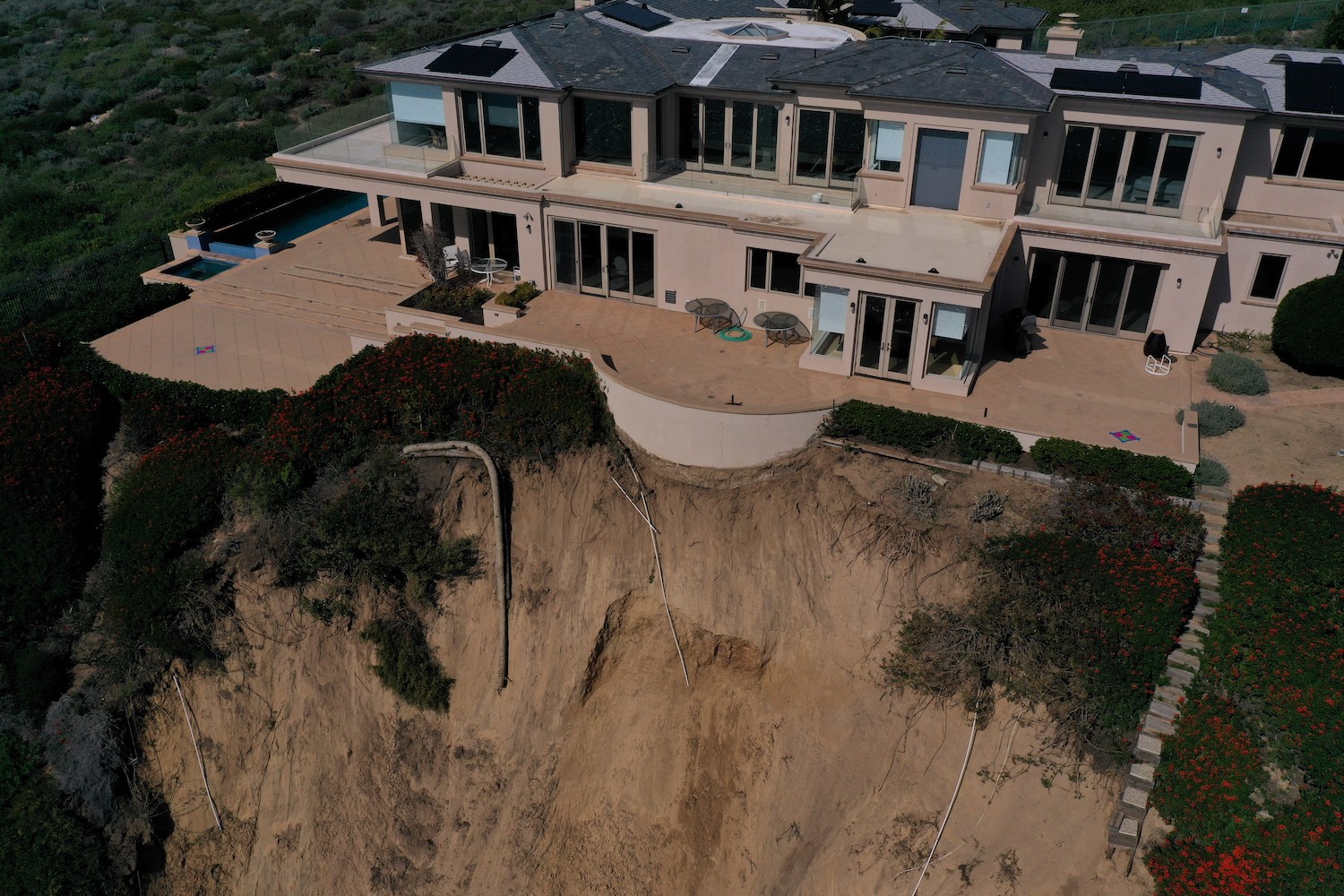 California clifftop homes teeter on edge after landslide, but stay ...